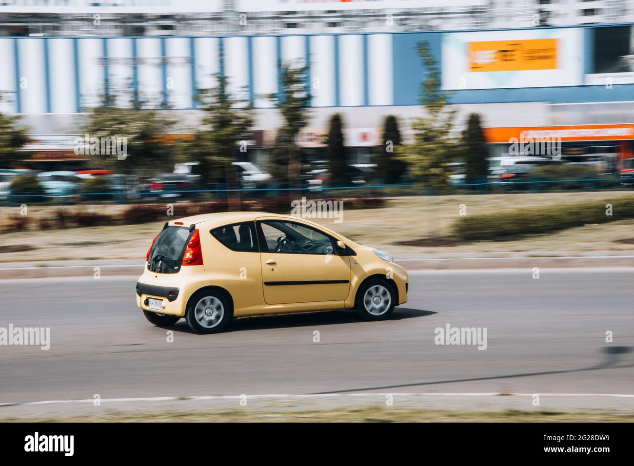 Ukraine, Kyiv - 13 May 2021: Yellow Peugeot 107 car moving on the ...