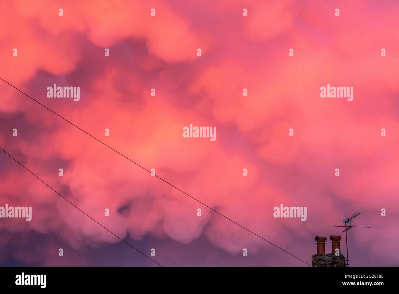 Angry pink clouds at the sky Stock Photo - Alamy
