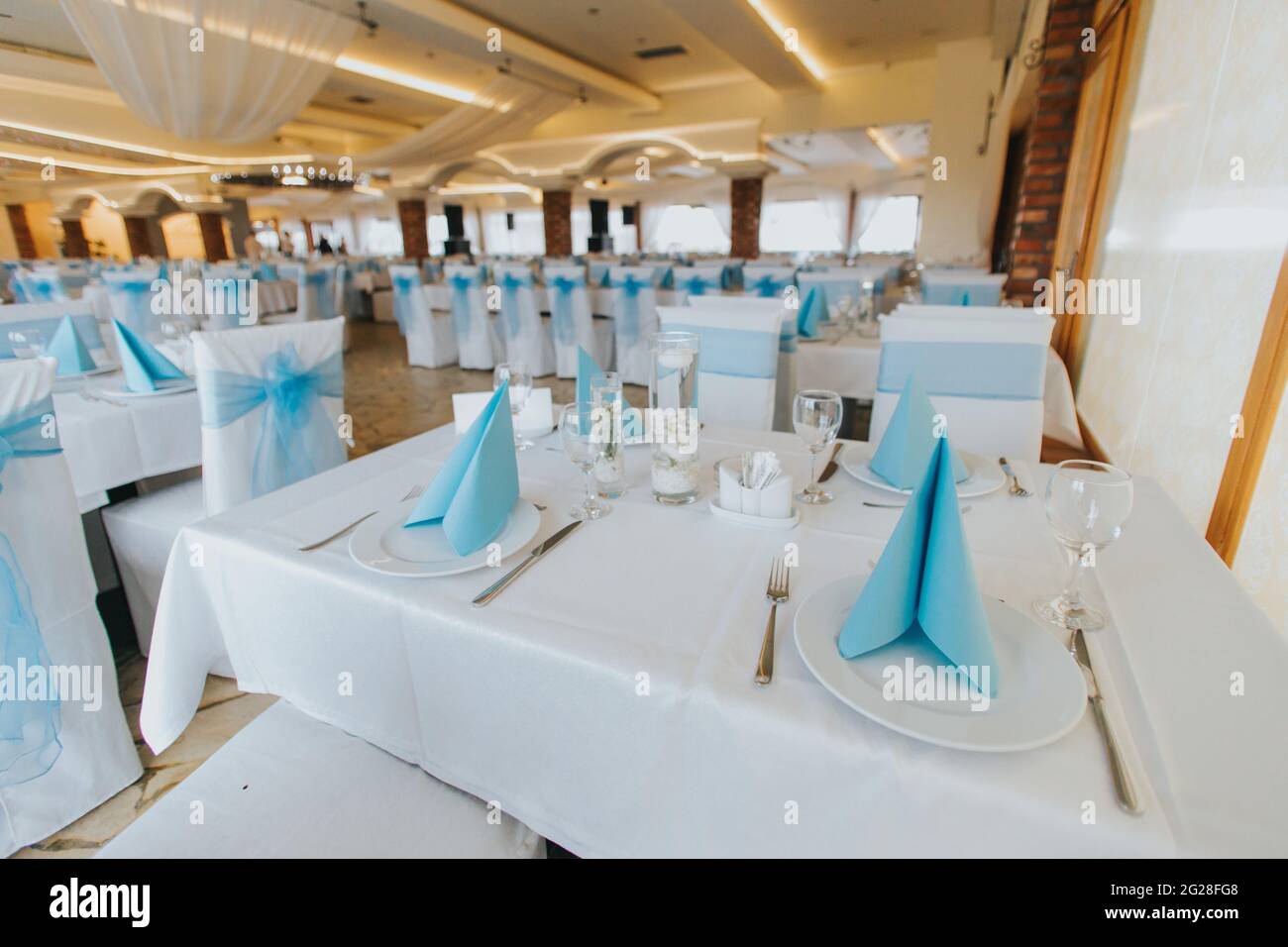 Banquet hall decorated for a wedding in white and blue Stock Photo - Alamy