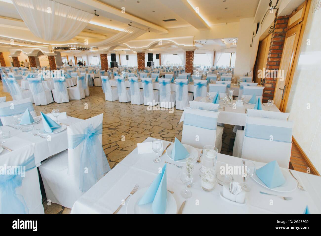 Banquet hall decorated for a wedding in white and blue Stock Photo - Alamy
