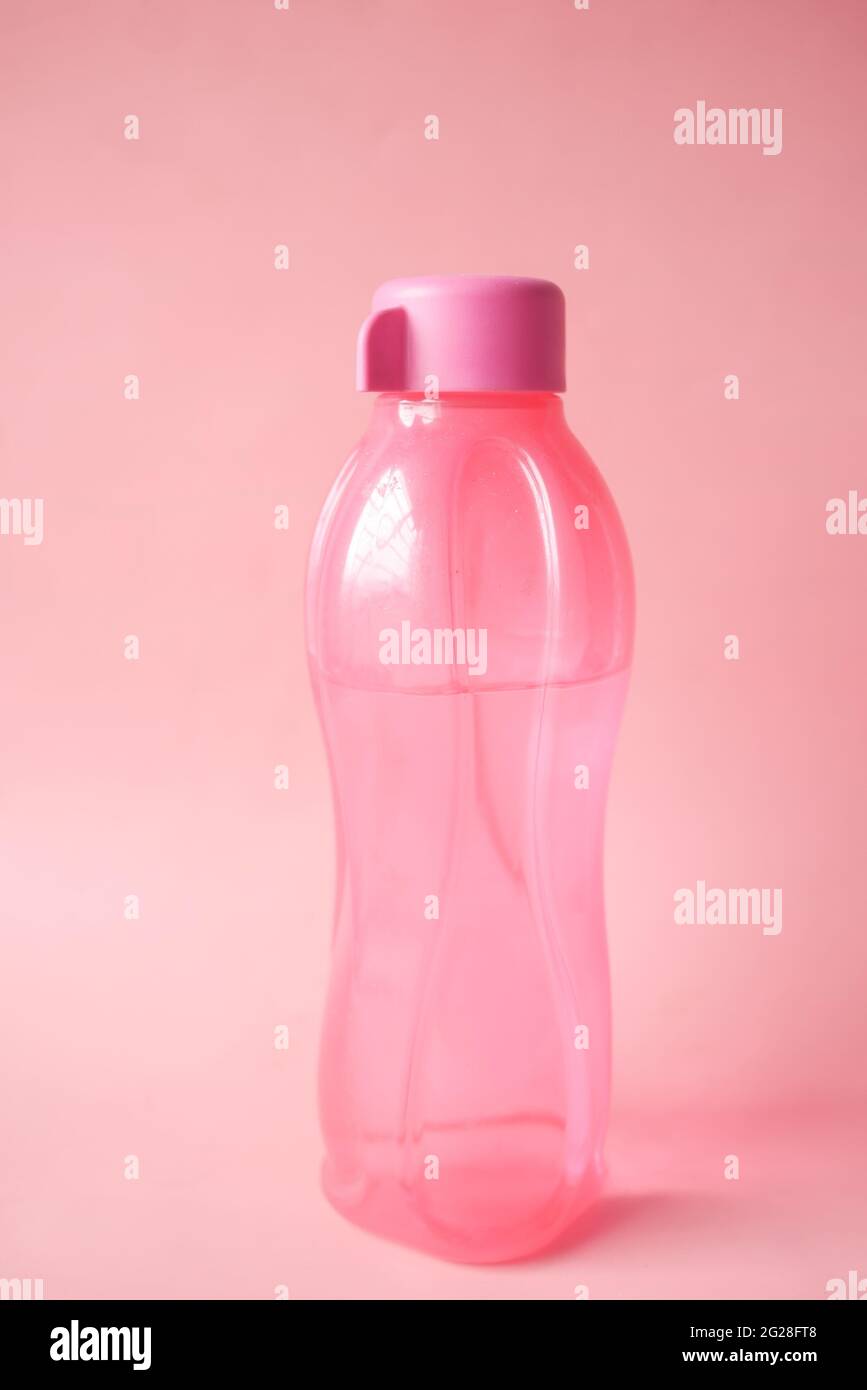 fresh drinking water in a pink color bottle Stock Photo - Alamy