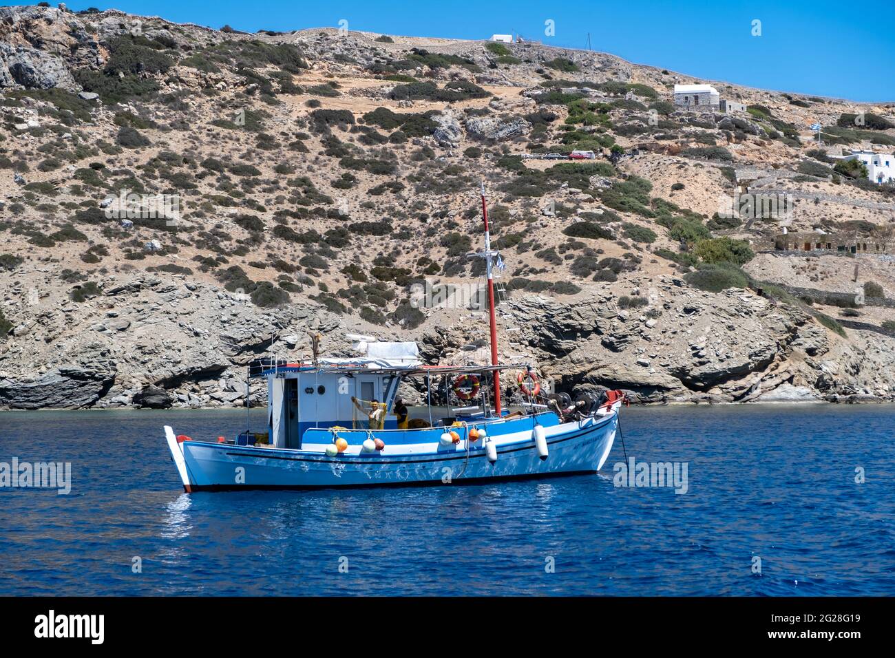 Greece, Koufonisi island. Cyclades. May 23, 2021. Fishing boat anchored ...