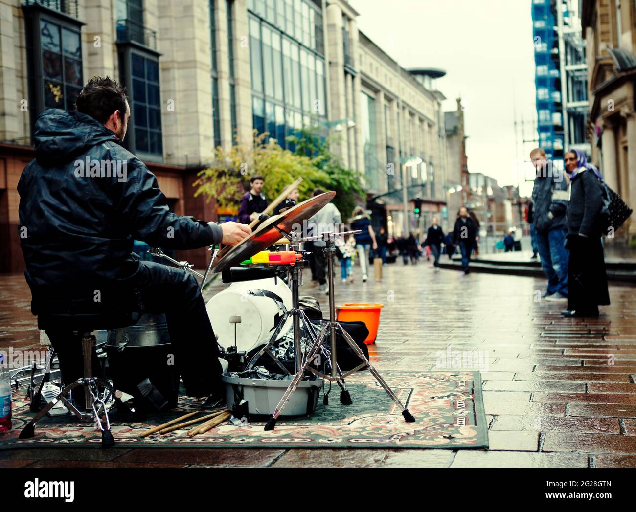Busker In The Rain High Resolution Stock Photography and Images - Alamy