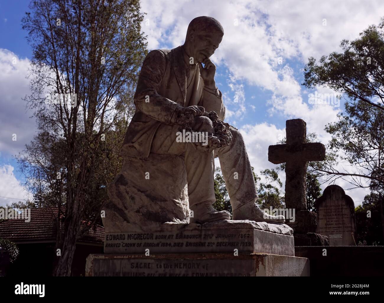 A life size and lifelike statue on an old grave at Mt. Gravatt cemetery ...