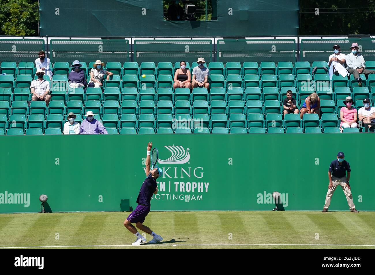 Australia's Matthew Ebden serves against Great Britain's Dan Evans ...