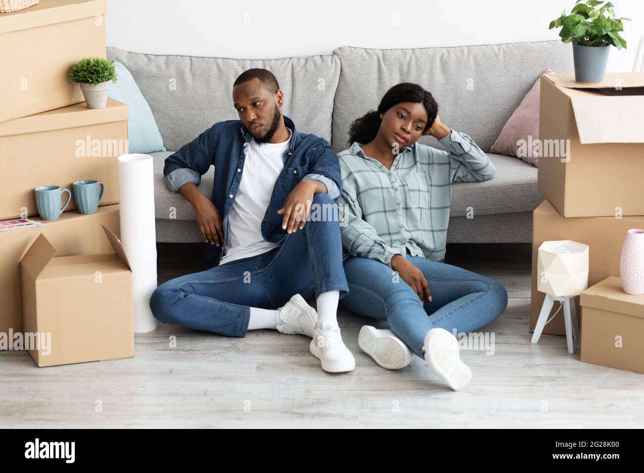 Portrait Of Tired Black Couple Sitting On Floor Exhausted After Moving ...