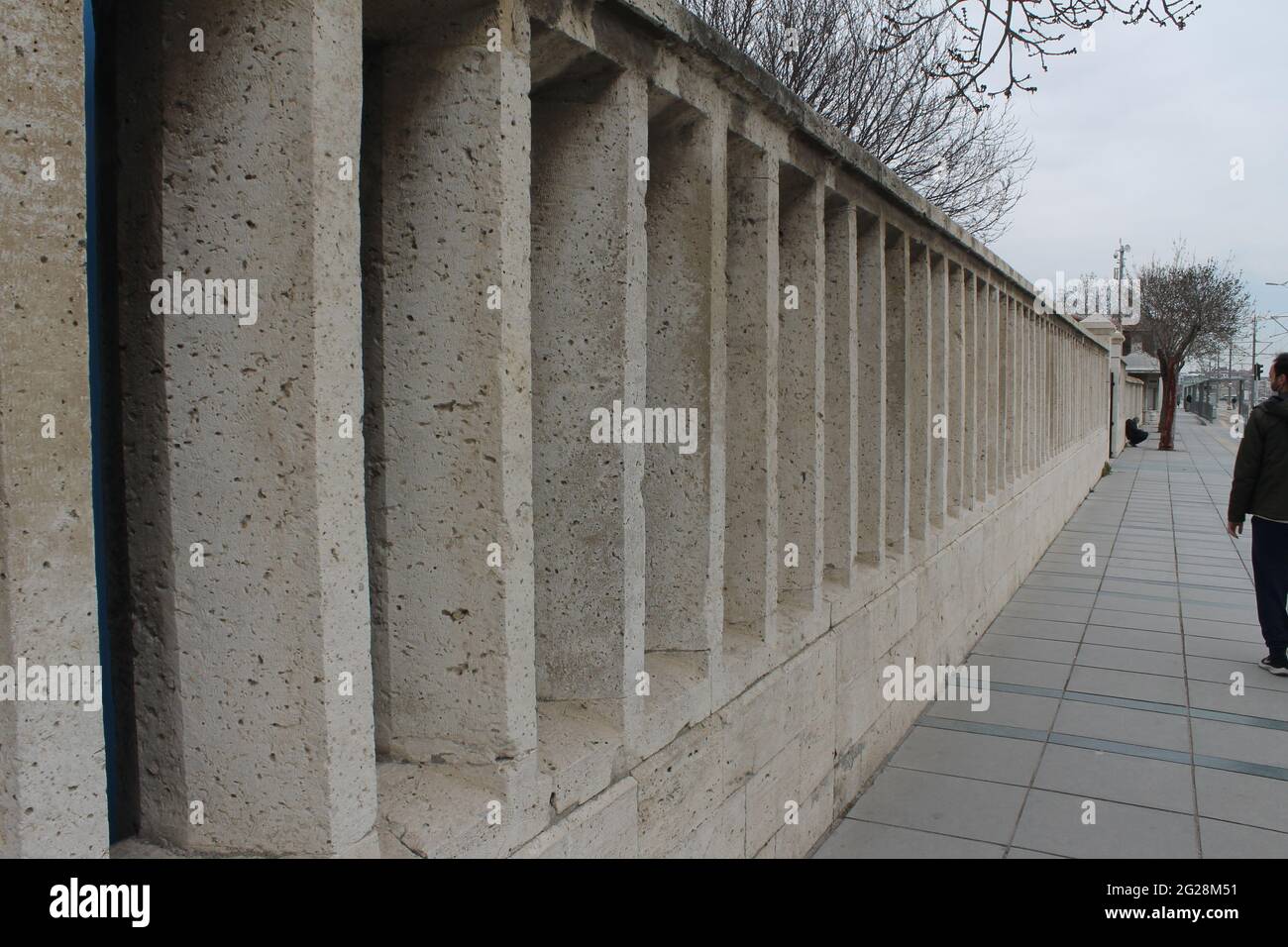 The aesthetic garden wall covered with columns made of lines and the ...