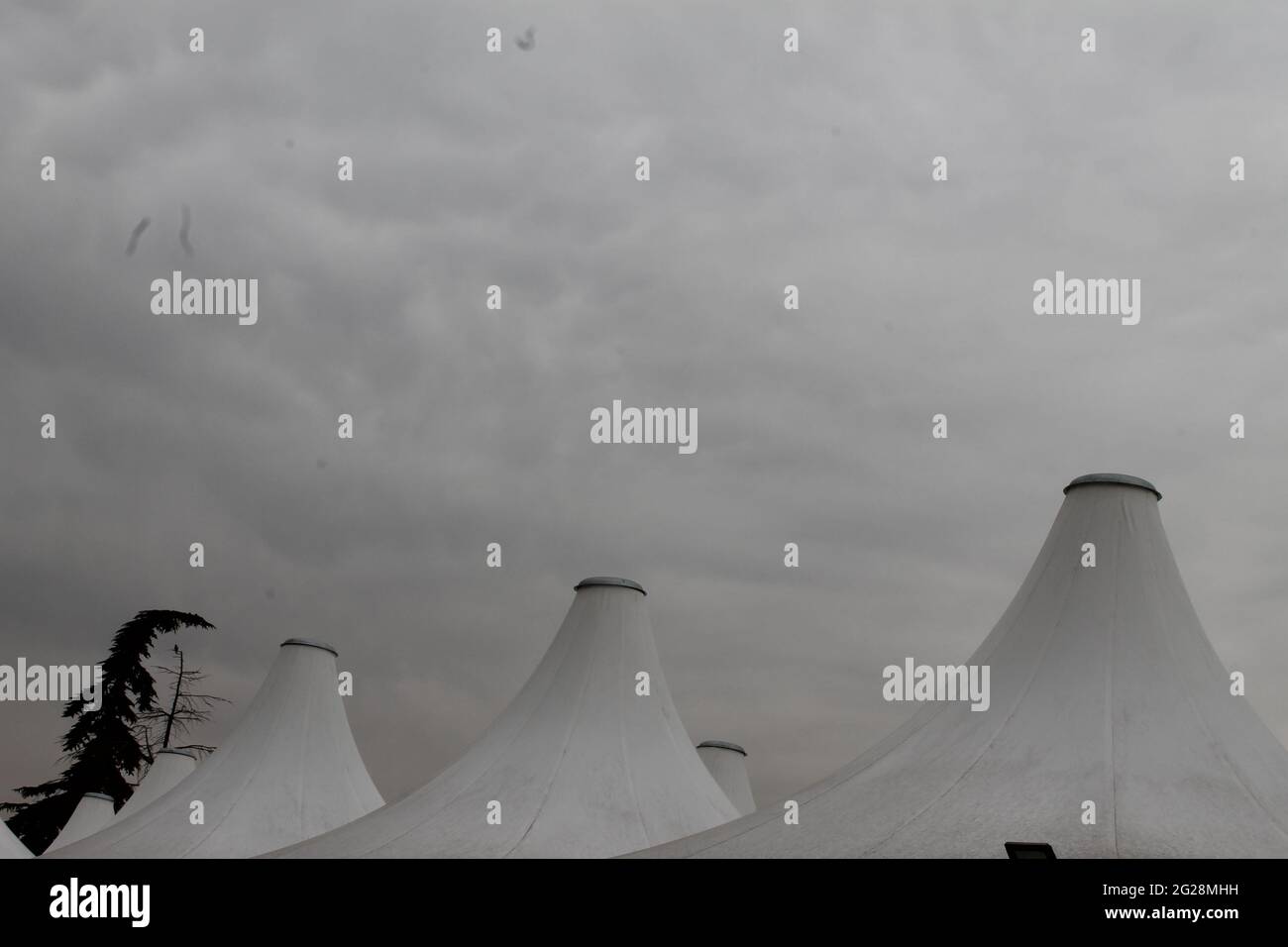 inverted funnel shaped tents and sky Stock Photo - Alamy
