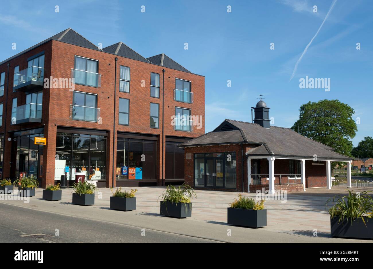 A view including Sainsbury`s Local store, Camp Road, Heyford Park ...