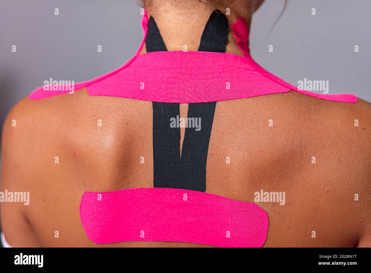 kinesio taping on the body, neck back in the salon Stock Photo - Alamy