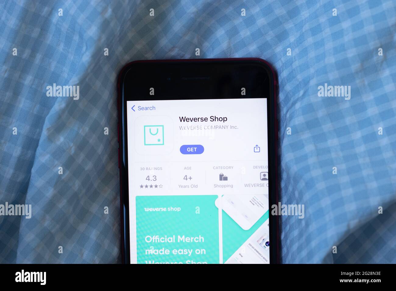 New York, USA - 1 June 2021: Weverse Shop mobile app logo on phone ...