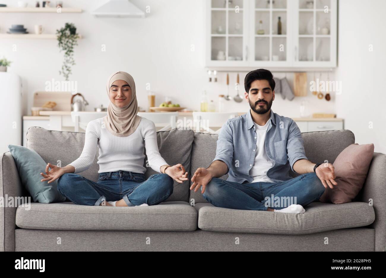 Couple meditating hi-res stock photography and images - Alamy