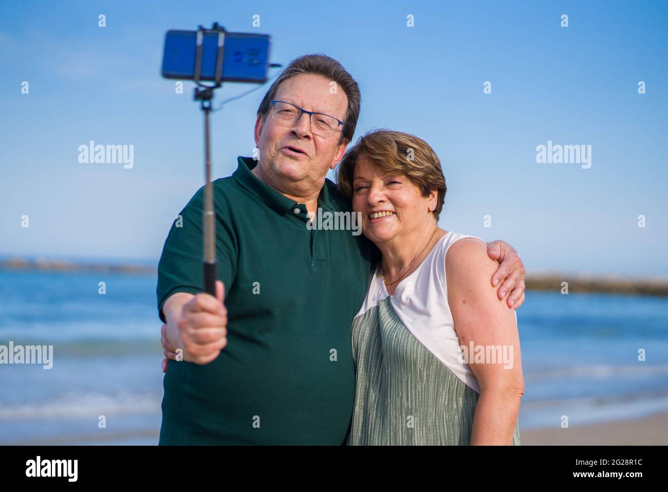 modern sweet and loving hispanic mature couple taking selfie portrait ...