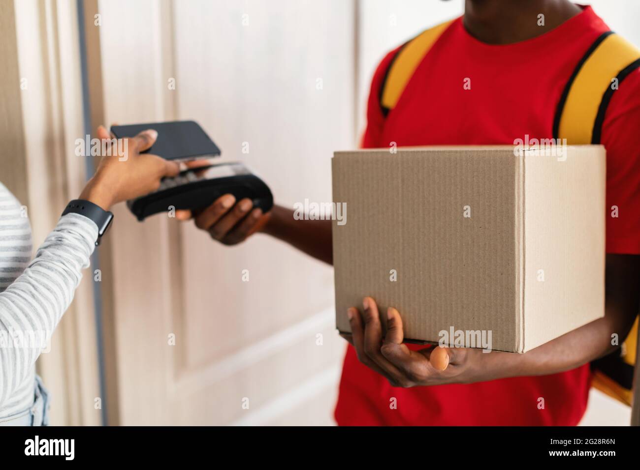 Lady paying courier using hi-res stock photography and images - Alamy
