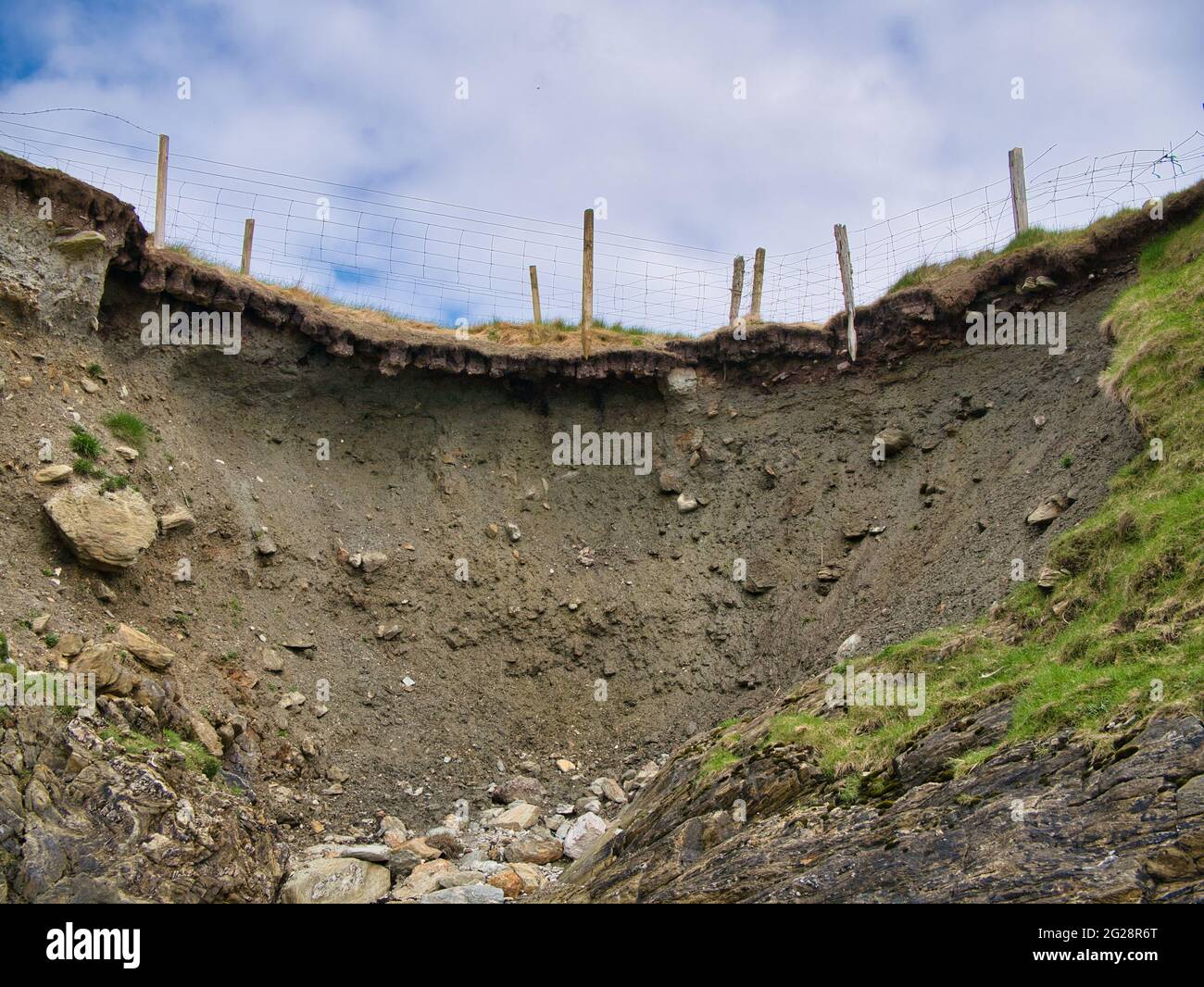 A section of a coastal walking path is lost due to erosion and landslip ...