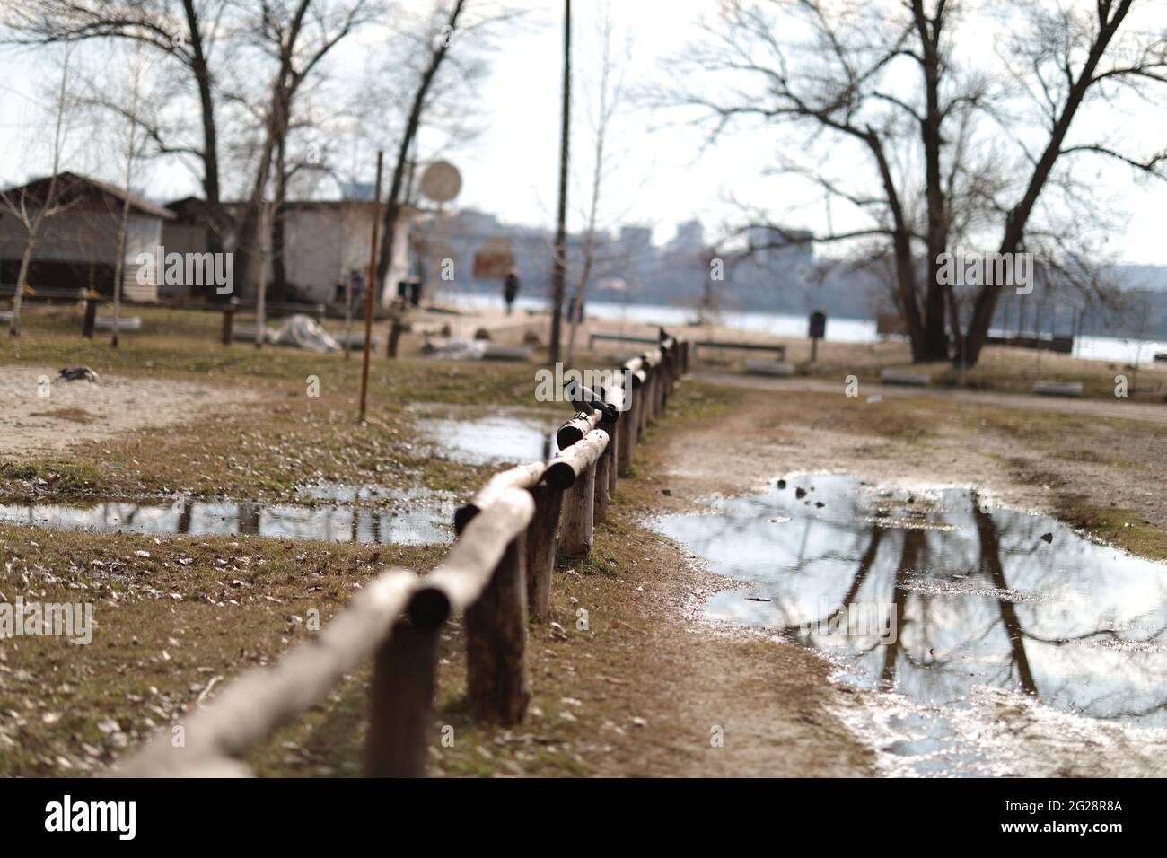 large puddles on the beach after rain in bad weather Stock Photo - Alamy