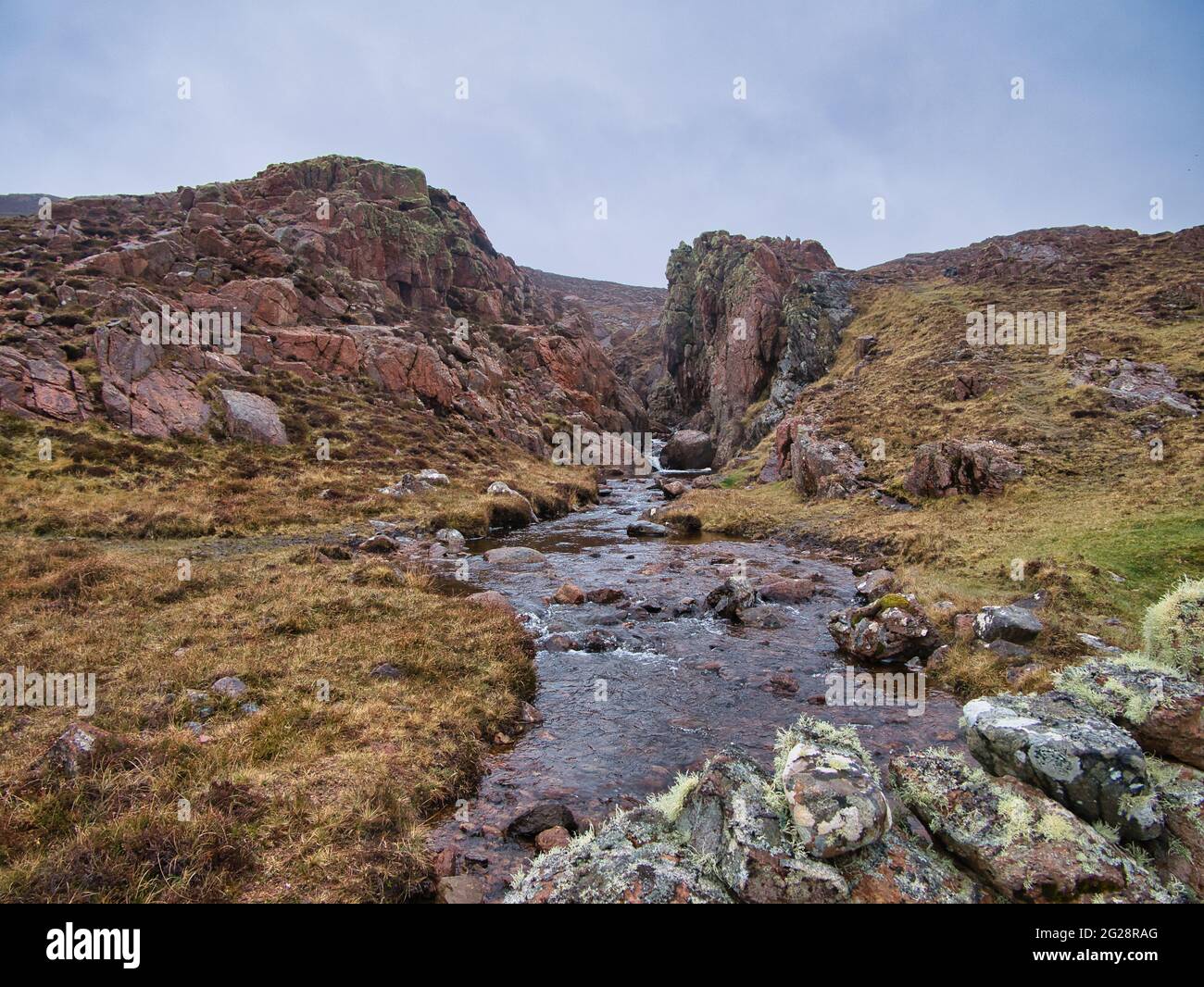 On an overcast, rainy day, the stream from Mill Loch on Muckle Roe ...