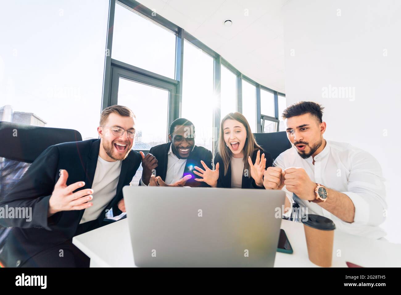 Group of multiracial finance company employees celebrate the company's ...