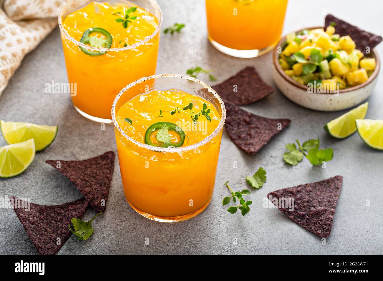 Pineapple and mango margarita with chips and guacamole Stock Photo - Alamy