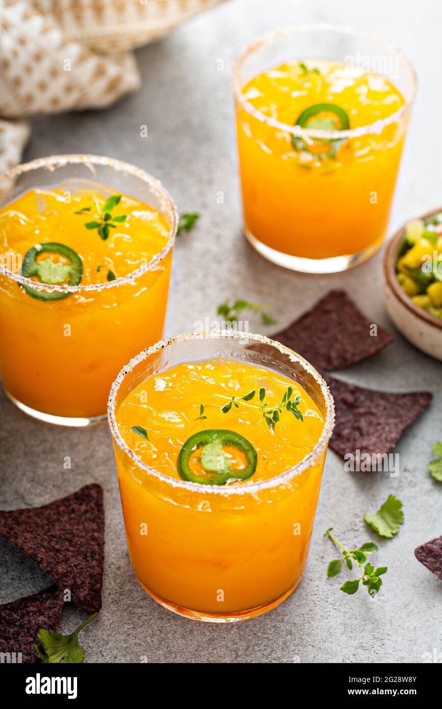 Pineapple and mango margarita with chips and guacamole Stock Photo - Alamy