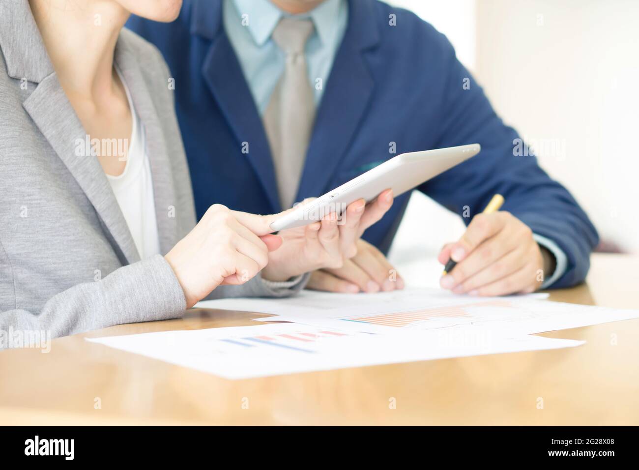 Young business partners discussing hi-res stock photography and images ...