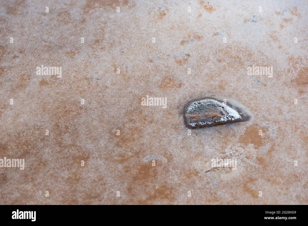loneliness. the texture of a salty lake with admixtures of red copper ...