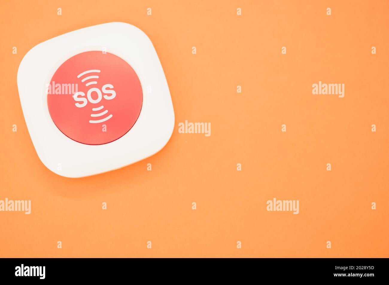 Top view of an SOS button on an orange surface Stock Photo - Alamy