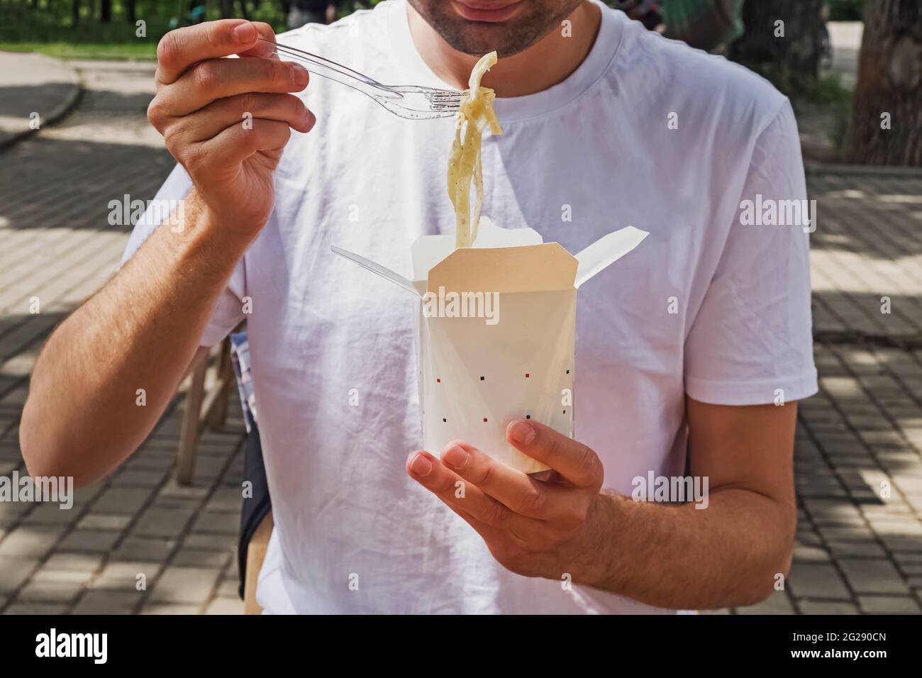 Close up man eating pasta hi-res stock photography and images - Alamy