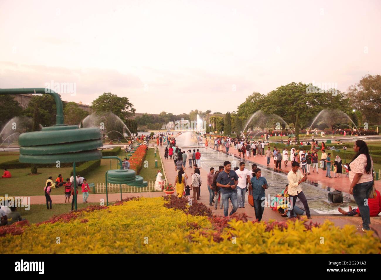 People walking in Brindavan Gardens with Fountains and Greenery in ...