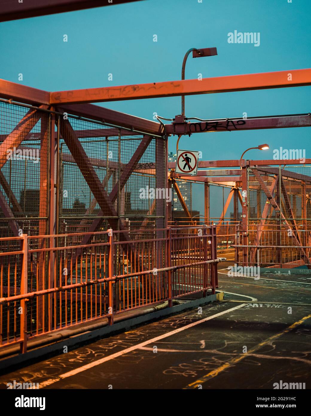 The Williamsburg Bridge pedestrian walkway at night, in New York City ...