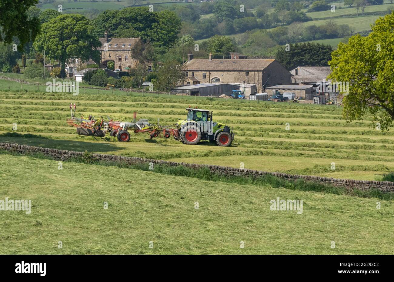 Farmer raking grass hi-res stock photography and images - Alamy