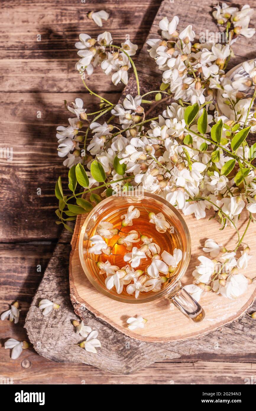 Tea from acacia flowers. Summer healthy vitamin drink, hard light, dark ...