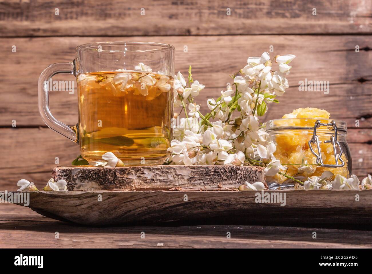 Tea from acacia flowers. Summer healthy vitamin drink, hard light, dark ...