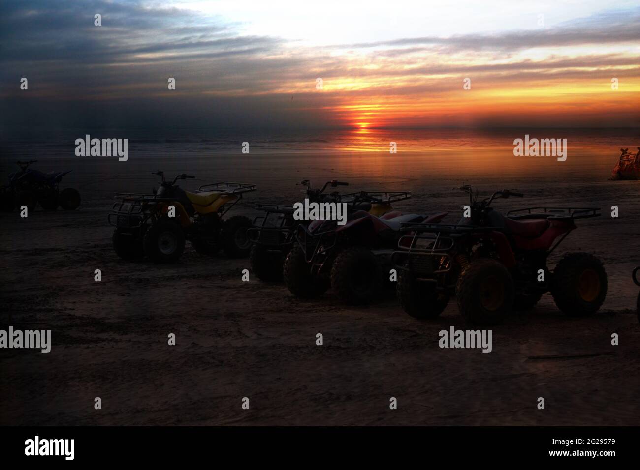 Beach Buggies parked on a beautiful beach at sunrise or sunset Stock ...
