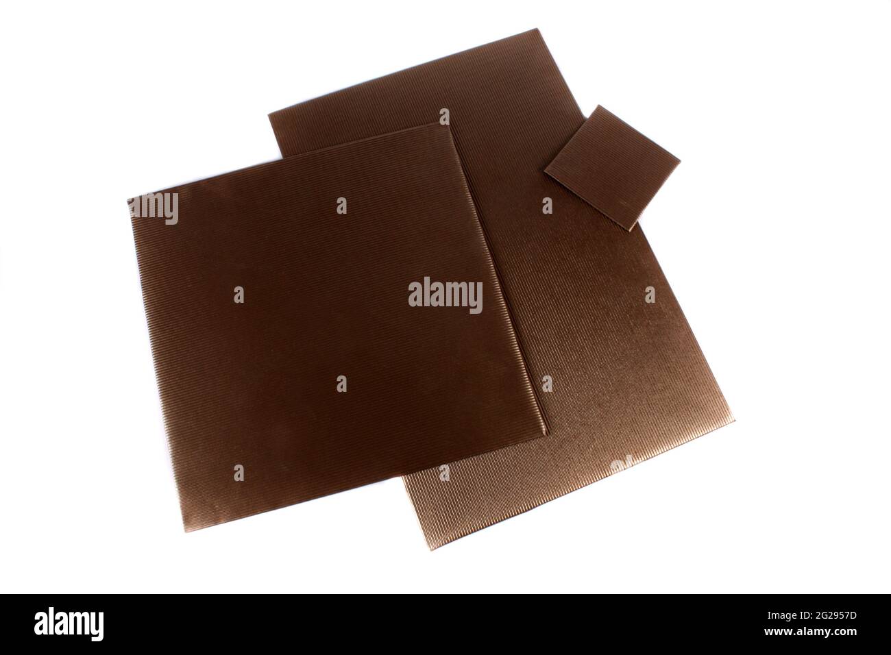 A set of table mats and coaster made of luxurious brown material Stock ...