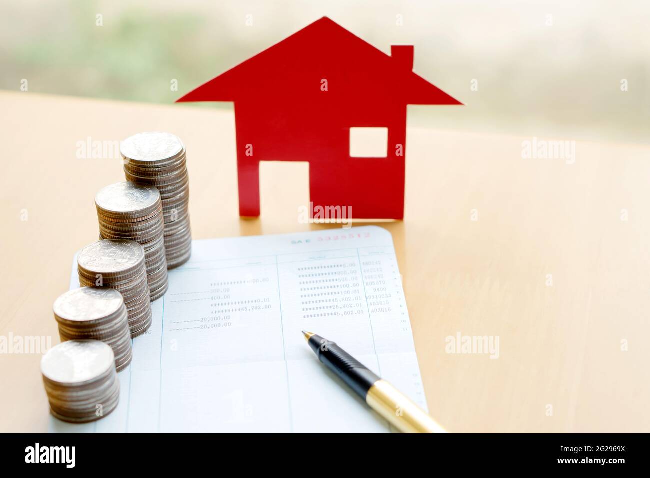 money, pile coin with saving book and paper home,concept Stock Photo ...