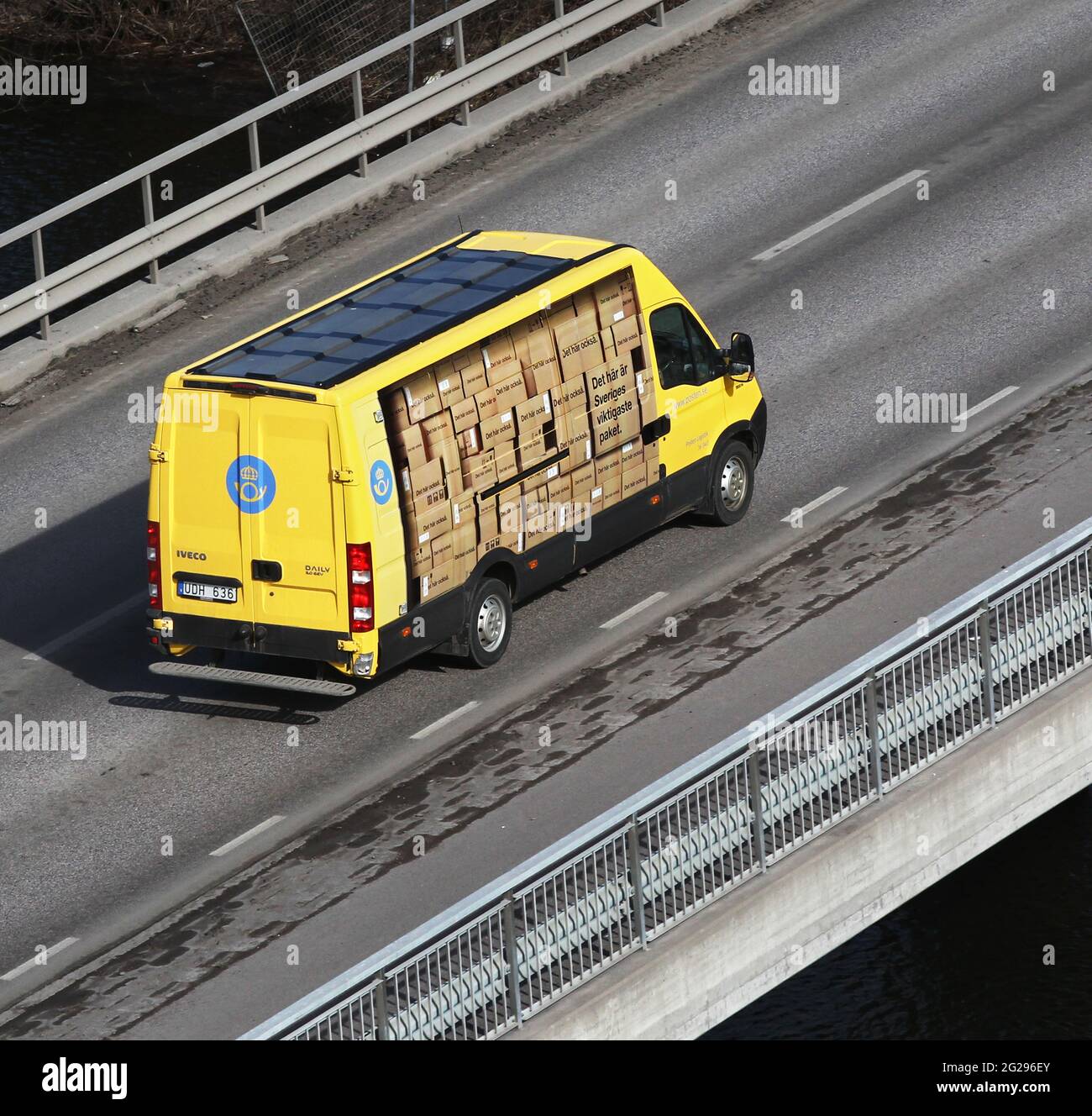 A mail van on the way with packages Stock Photo - Alamy
