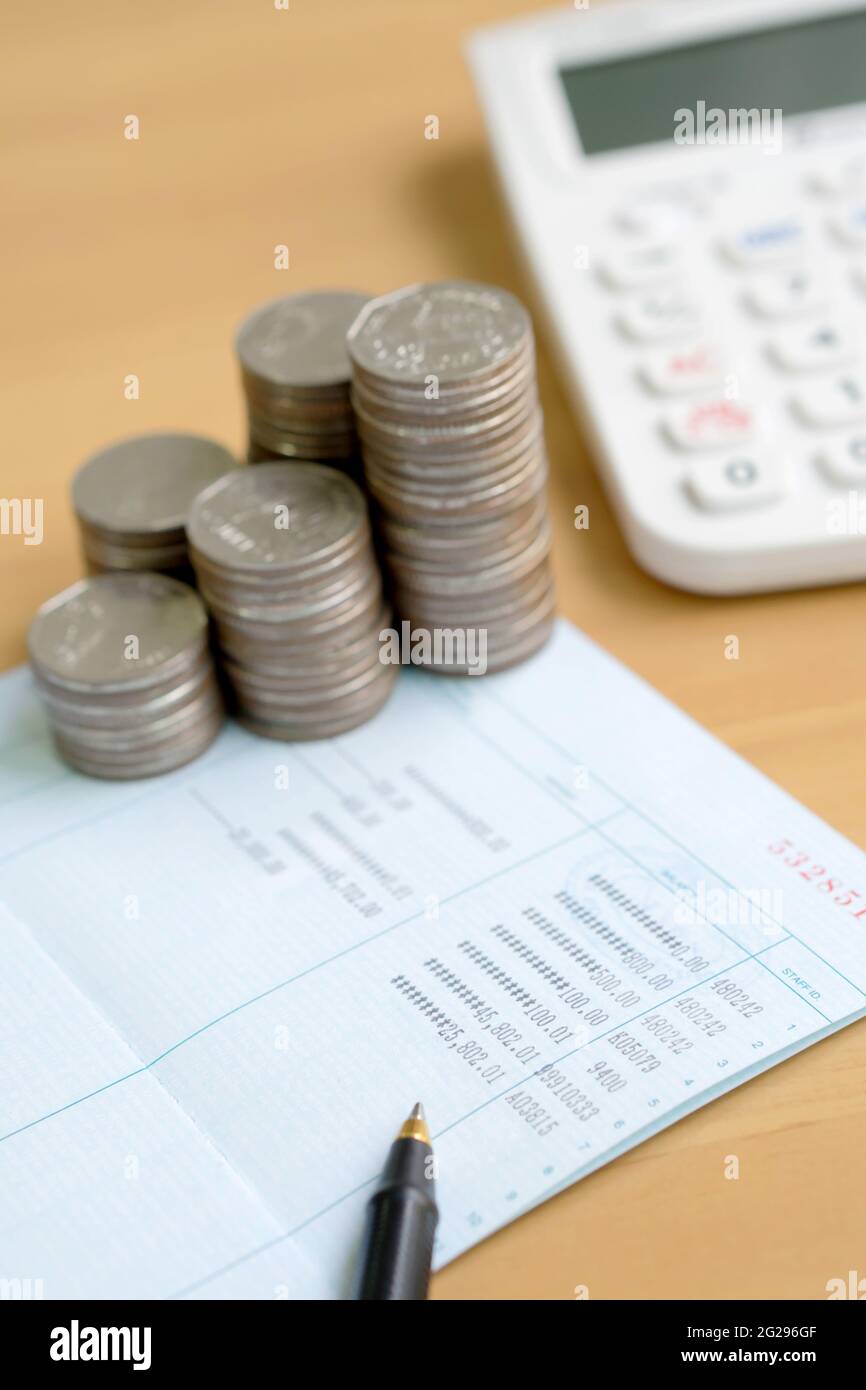 Coins stack in columns with saving book finance and banking concept for ...