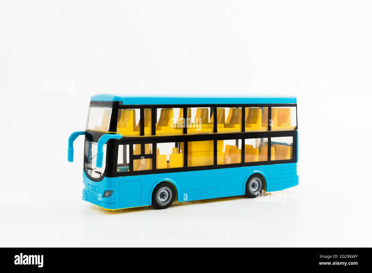 Small blue plastic touristic double-decker bus toy with yellow seats on ...