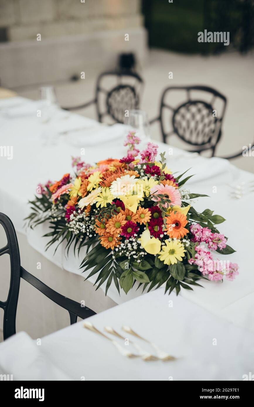 Flower arrangement on a table ready for wedding reception Stock Photo ...