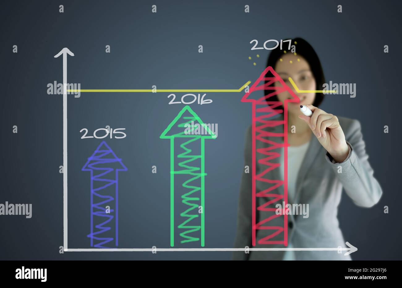 business woman drawing over target achievement graph Stock Photo - Alamy