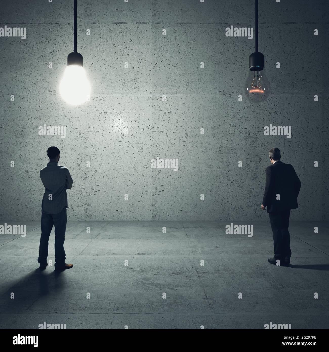 men looks at two light bulbs. one is on, connection of idea and ...