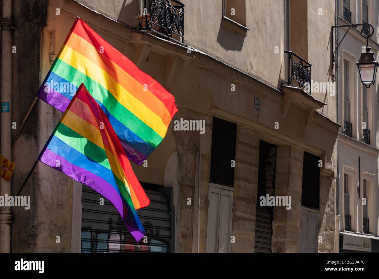 Lgbtq flags hanging at historic building corner during Paris pride ...