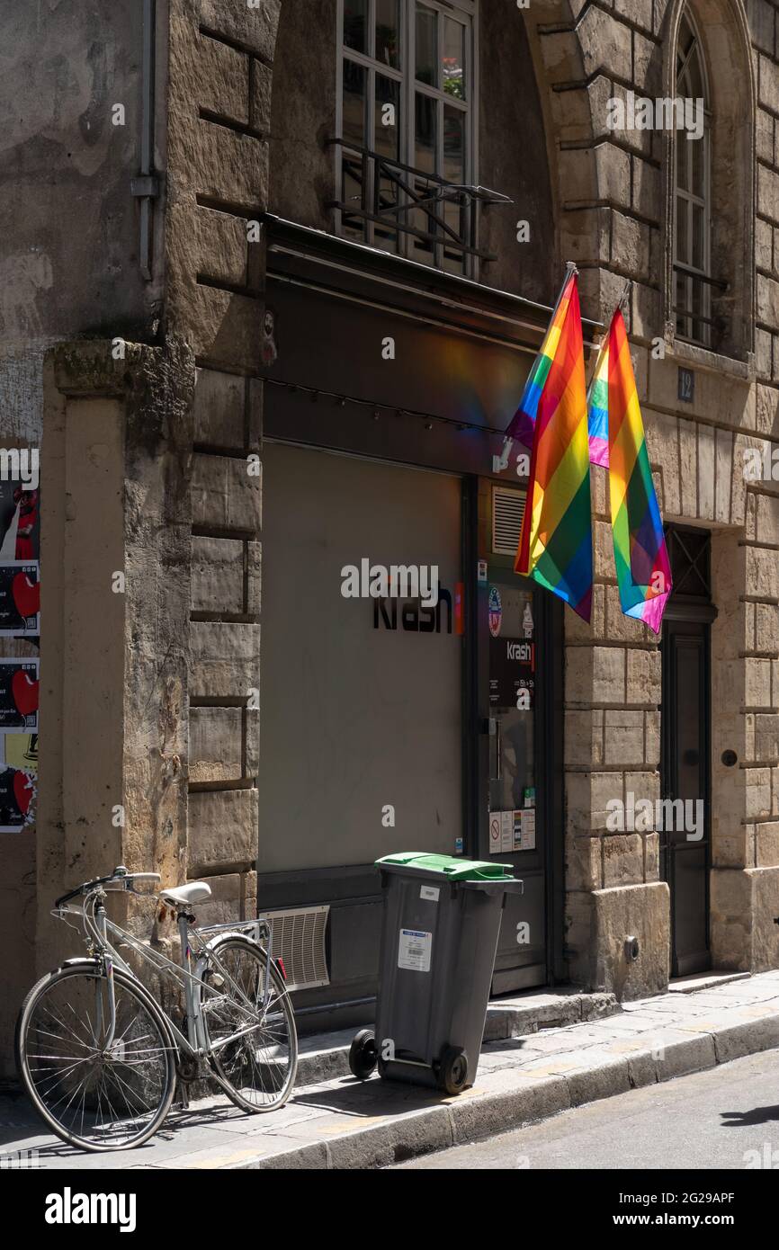 Bicycle at Paris city street with Lgbtq flags hanging under arch ...