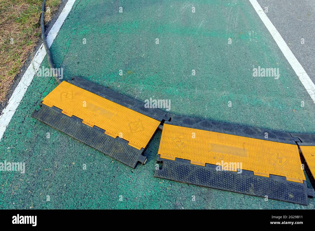 Black and yellow heavy plastic covers for people and vehicle to cross ...