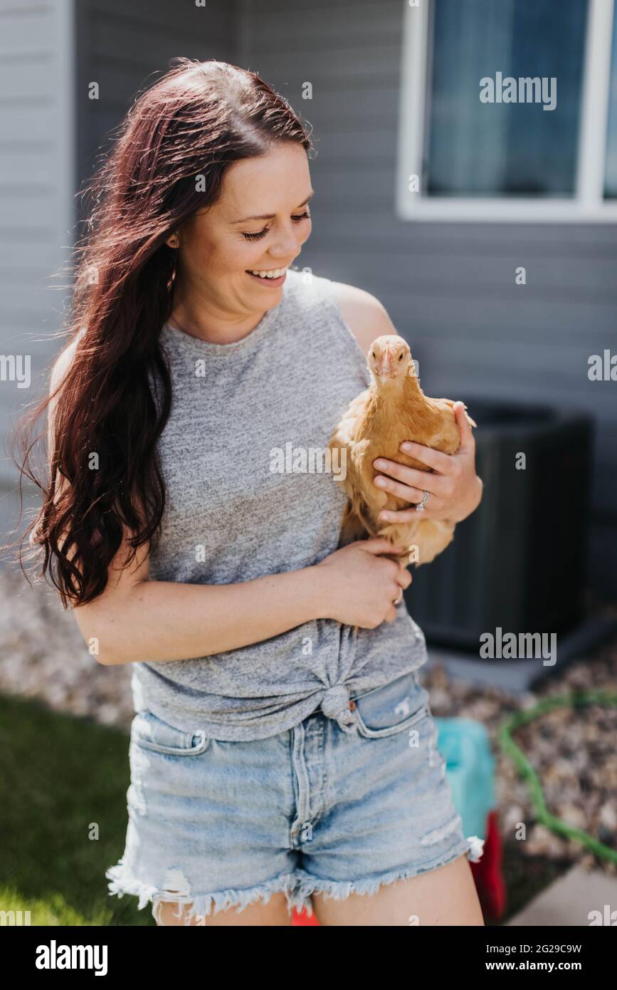 Chickens outside with woman hi-res stock photography and images - Alamy