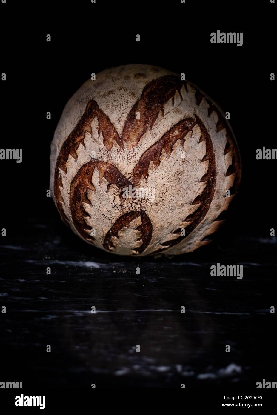 Sourdough Boule with Flame Scoring Pattern Stock Photo - Alamy