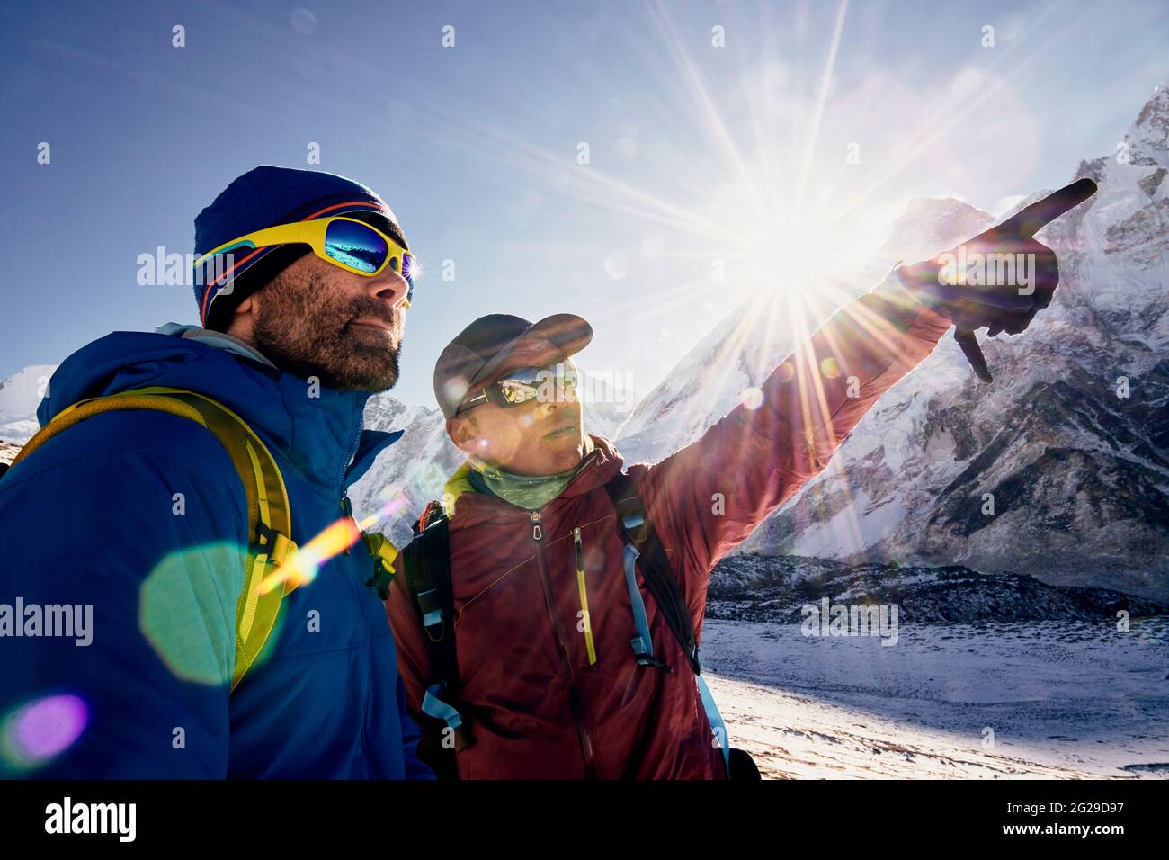 Sherpa and guide looking out in the distance with Mount Everest Stock ...