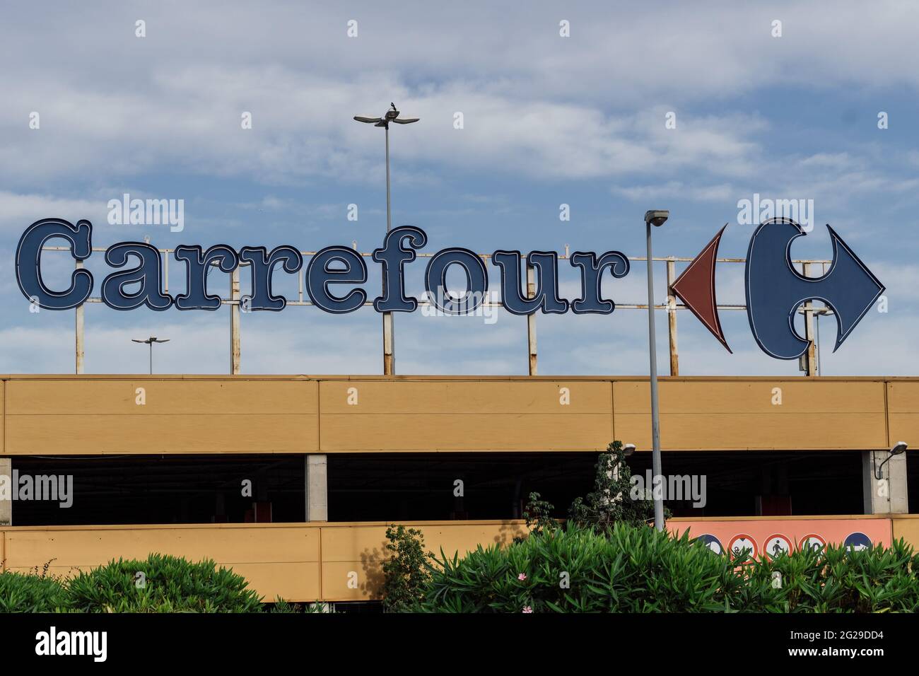 Barcelona, Spain - May 16, 2021. Logo and facade of Carrefour, a ...