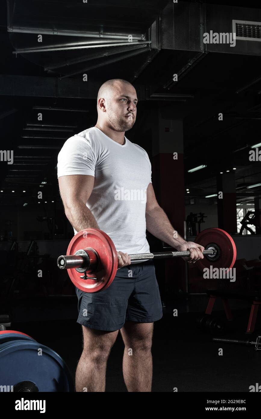 Young athlete lifts heavy barbell hi-res stock photography and images ...